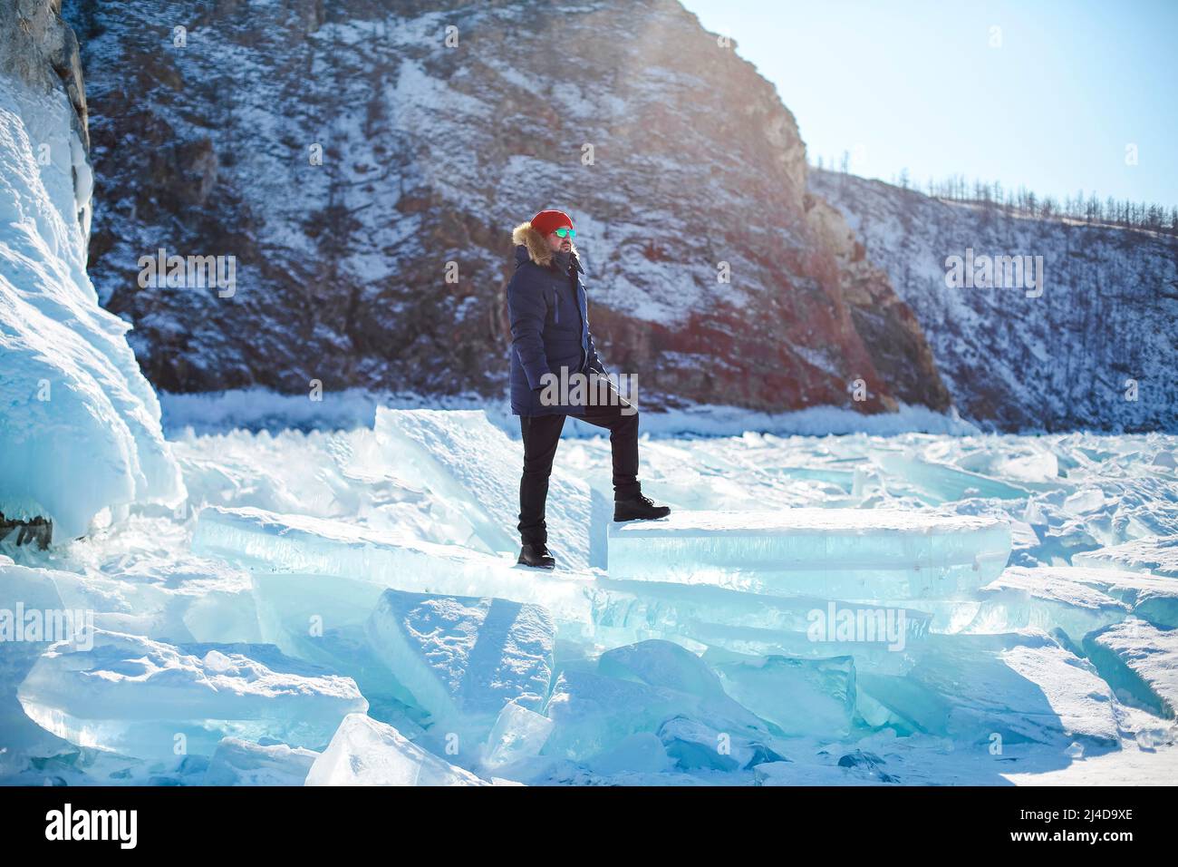 Travel and winter holiday. Lake Baikal. Portrait of the man tourist in ...