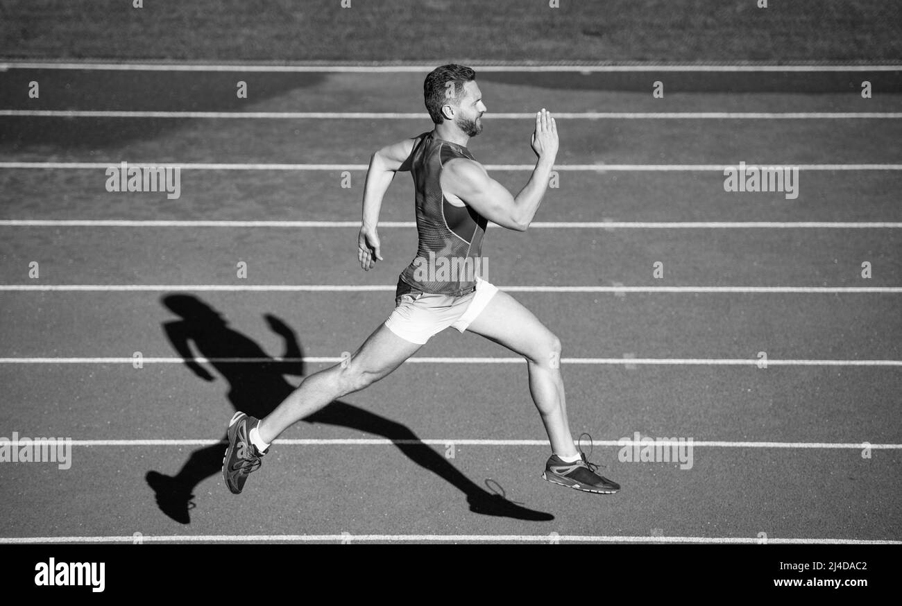 male sprinter running from start to finish with success and speed, race ...