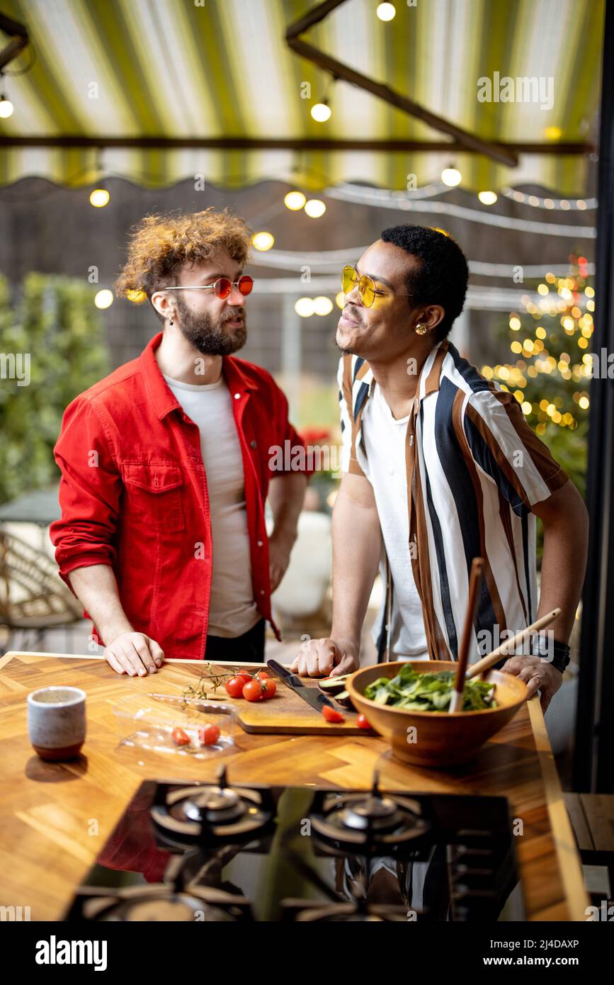 Two guys cooking healthy together at home Stock Photo - Alamy