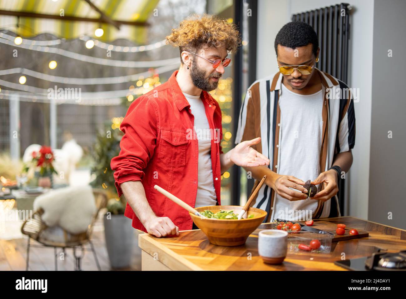 Two guys cooking healthy together at home Stock Photo - Alamy