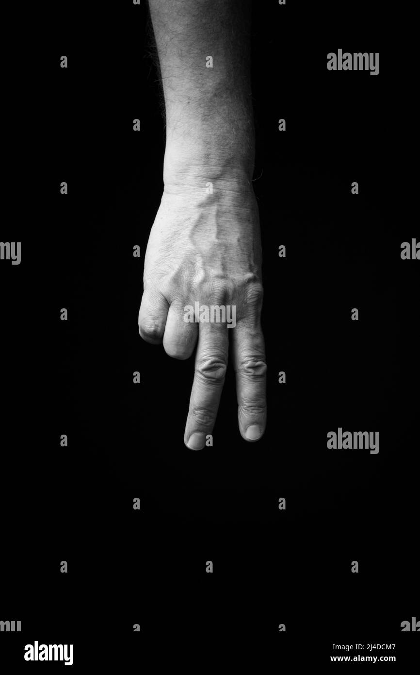 Dramatic black and white image of a male hand fingerspelling the ...