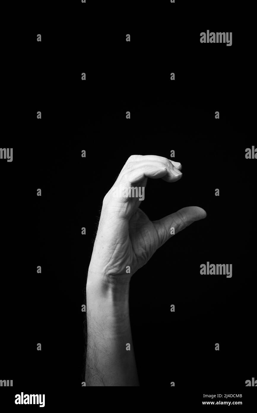 Dramatic black and white image of a male hand fingerspelling the ...