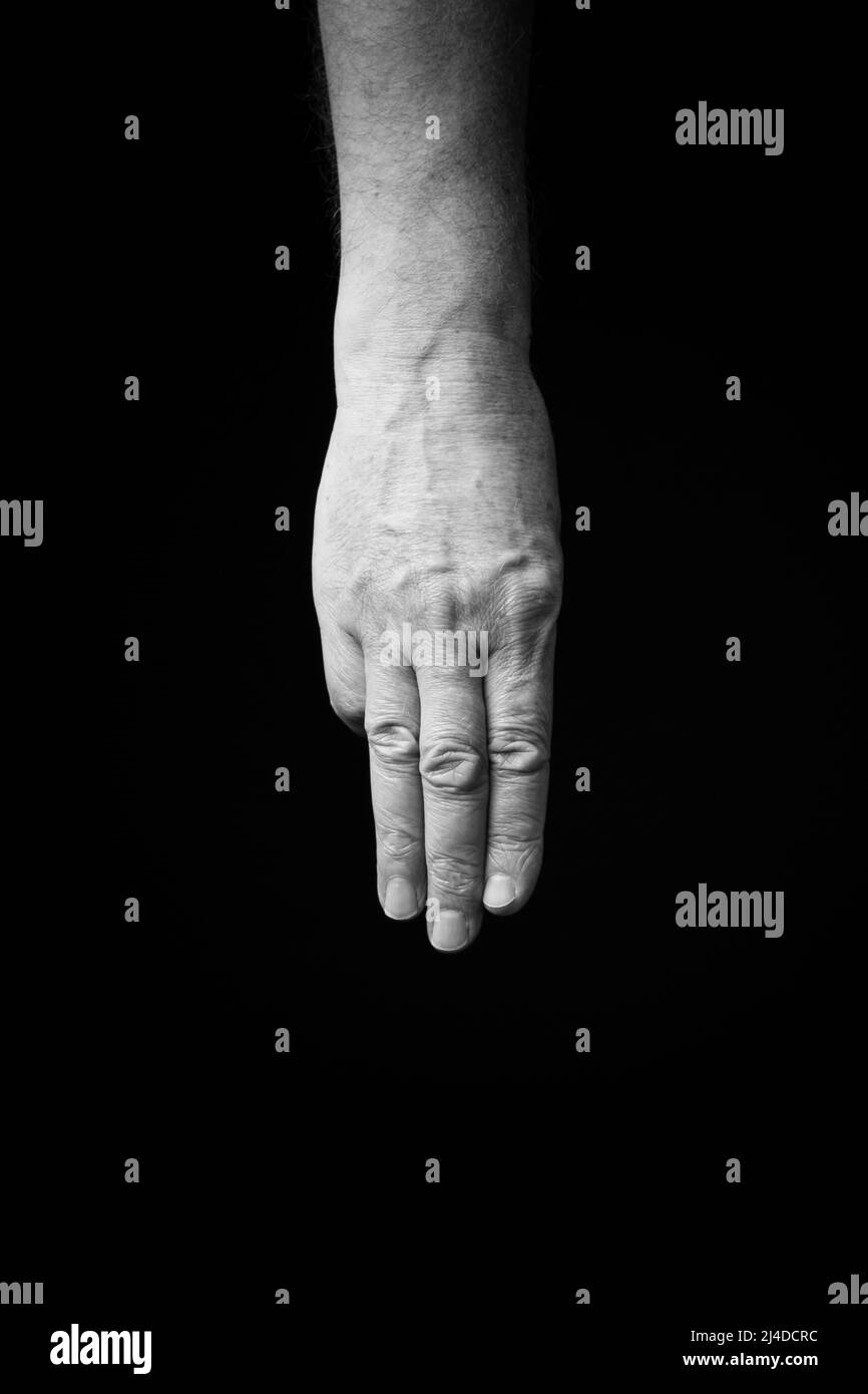 Dramatic black and white image of a male hand fingerspelling the ...