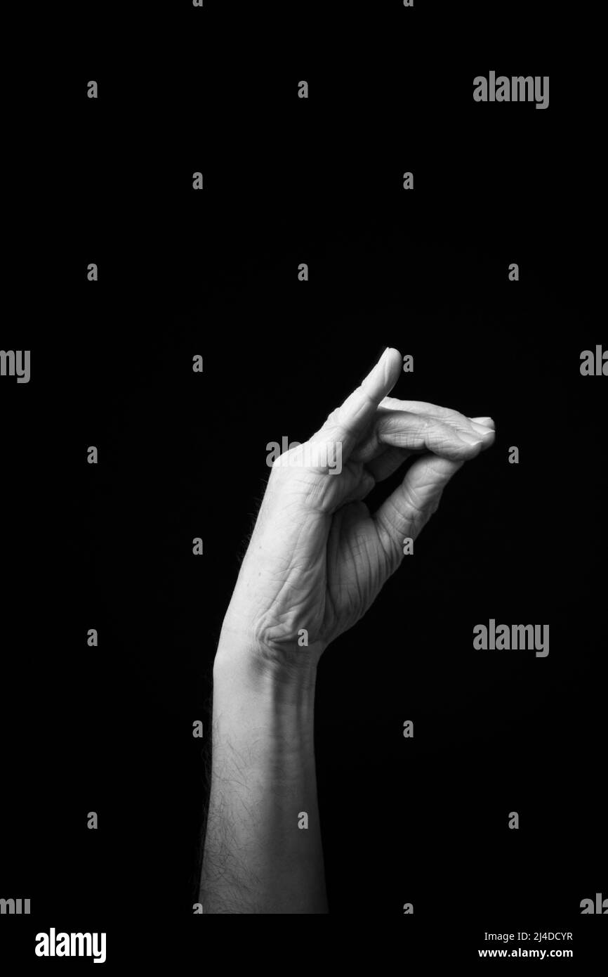 Dramatic black and white image of a male hand fingerspelling the ...