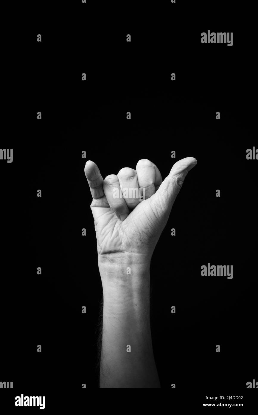 Dramatic black and white image of a male hand fingerspelling the ...