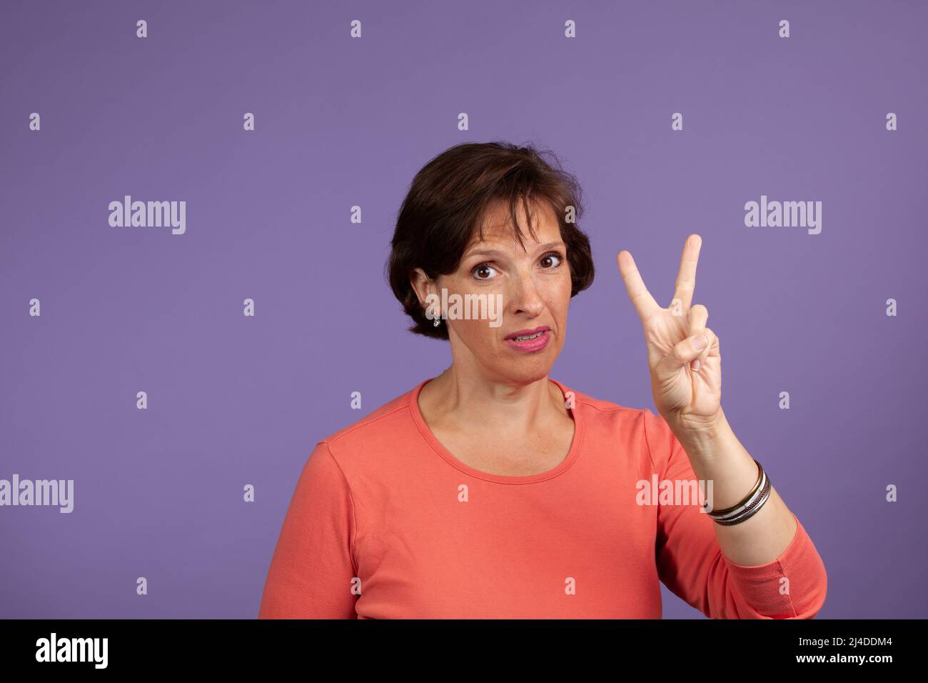 Two fingers woman hi-res stock photography and images - Alamy