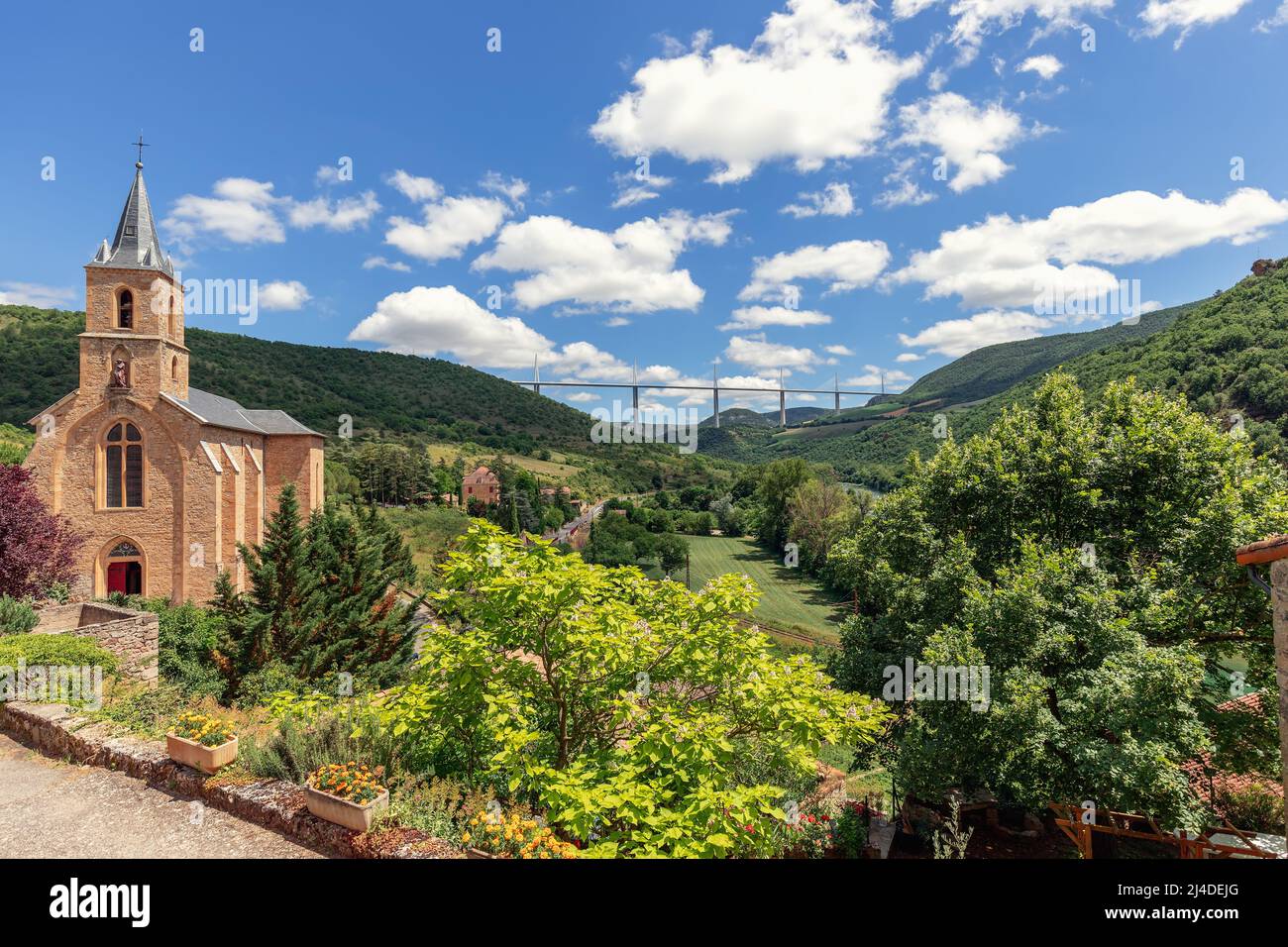 Full of green trees and plants in bloom Tarn valley, Church of St ...