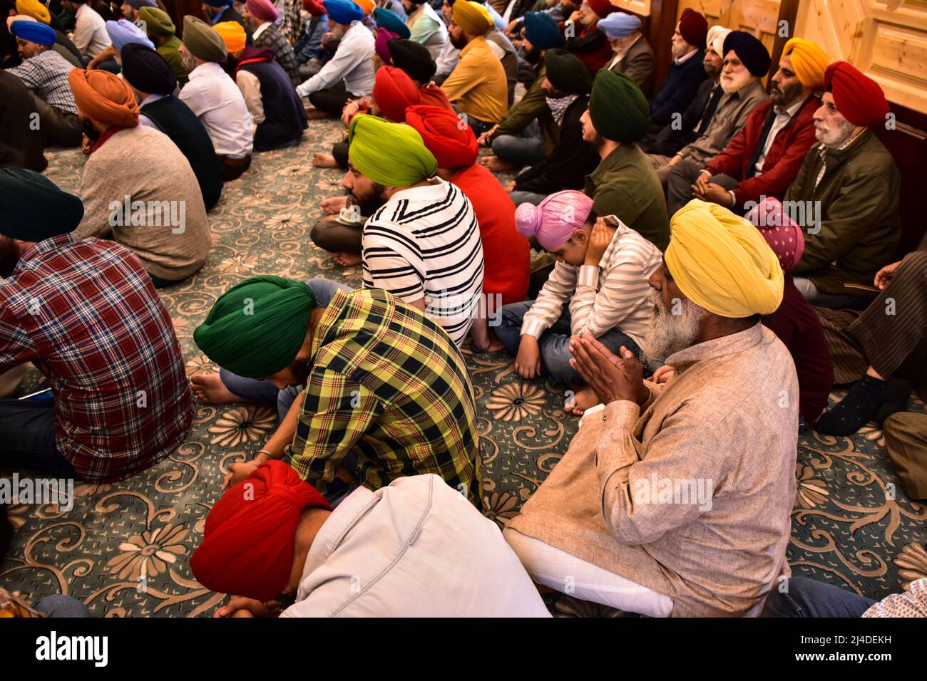 Sikh devotees attend rituals inside a Gurdwara or a Sikh temple on the ...