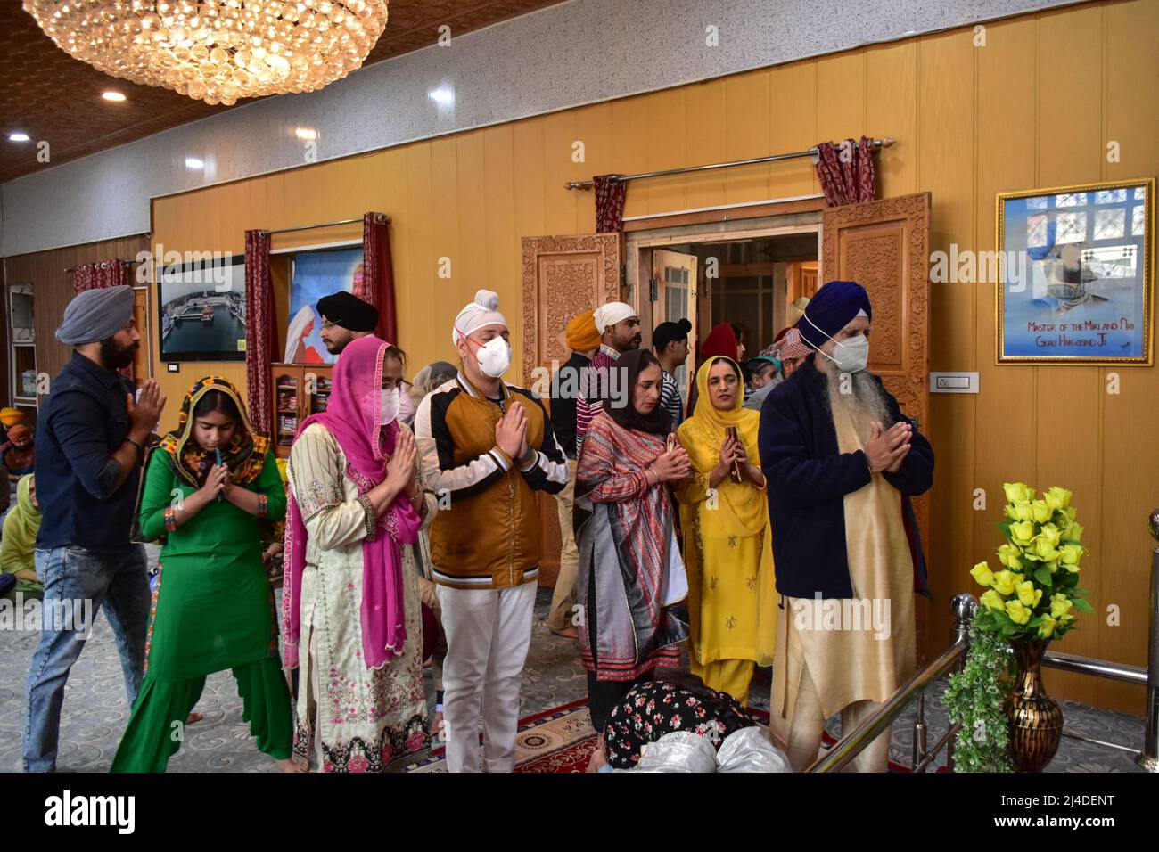 Sikh devotees pray inside a Gurdwara or a Sikh temple on the occasion of Baisakhi in Srinagar ...
