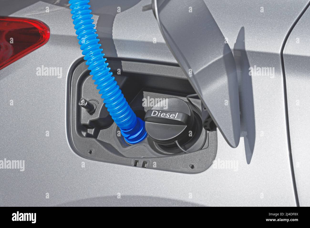 Refill AdBlue in modern diesel car Stock Photo - Alamy