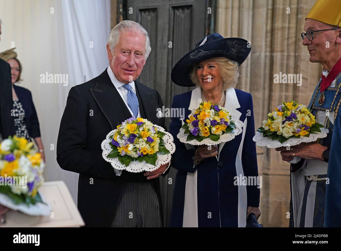 The Prince of Wales and the Duchess of Cornwall are greeted by the Dean ...