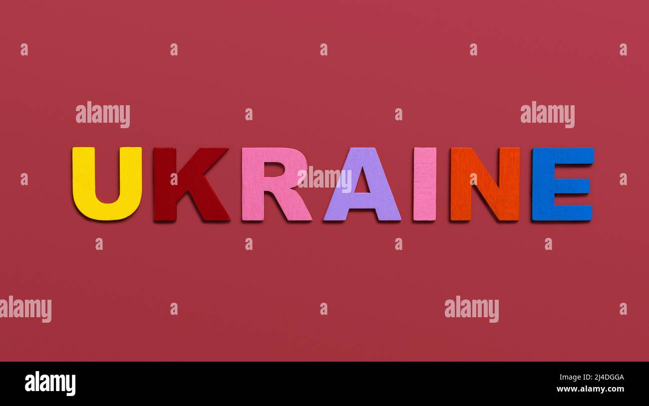 Ukraine, word written in colorful wooden alphabet letters on red ...