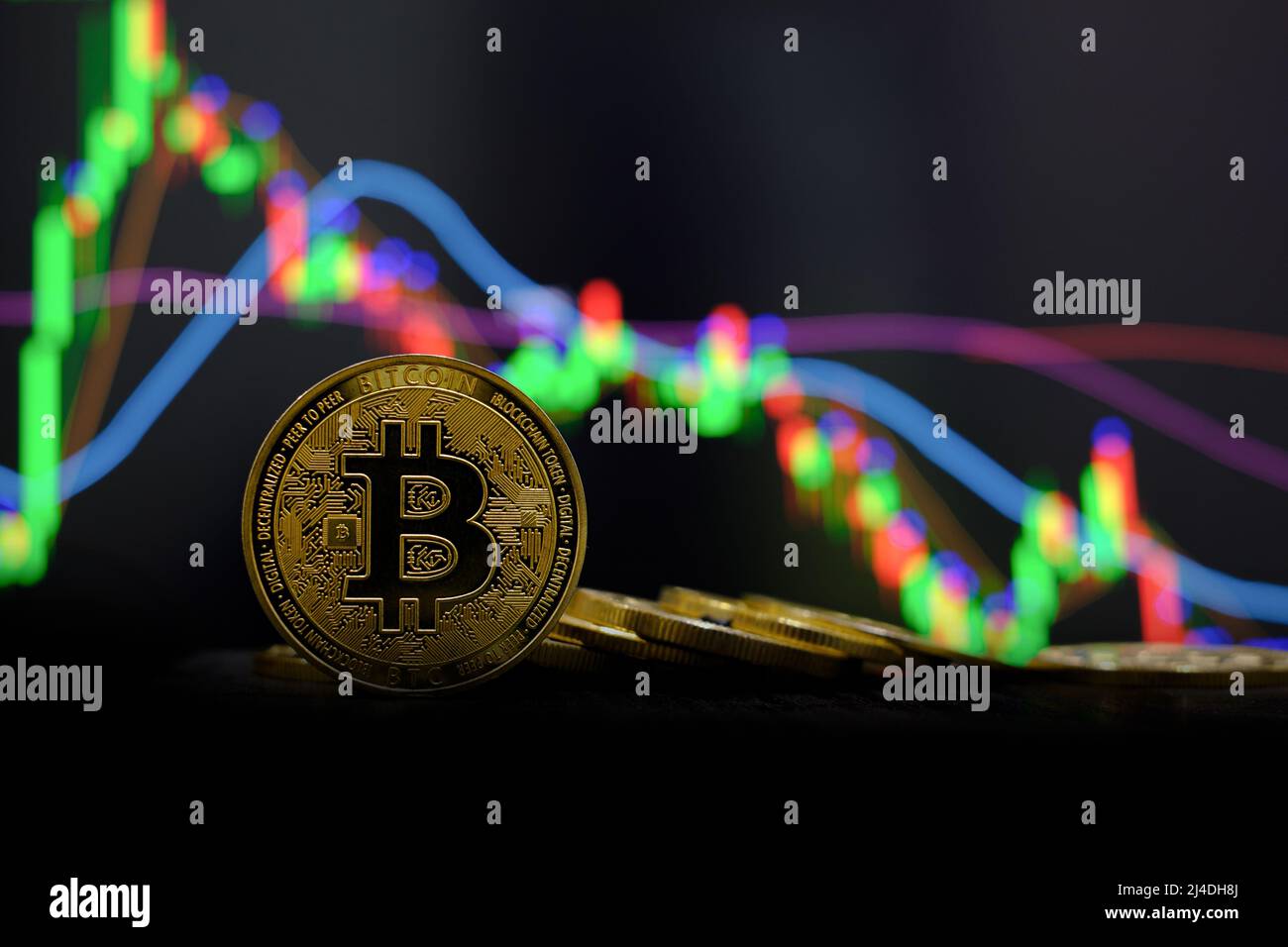 Golden bitcoin cryptocurrency at trading chart background Stock Photo ...