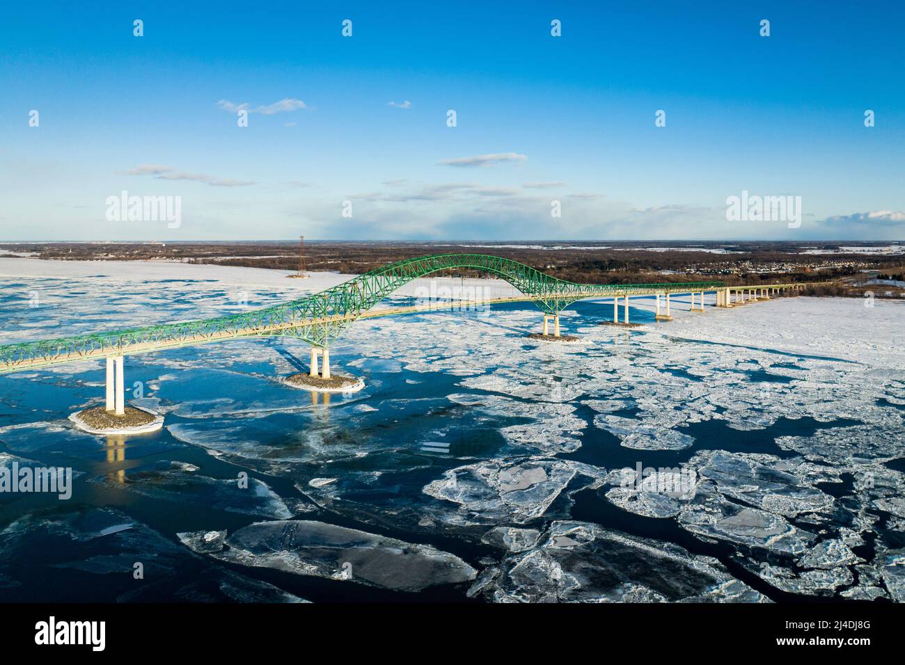 Laviolette Bridge, during winter, crossing the St. Lawrence River and ...