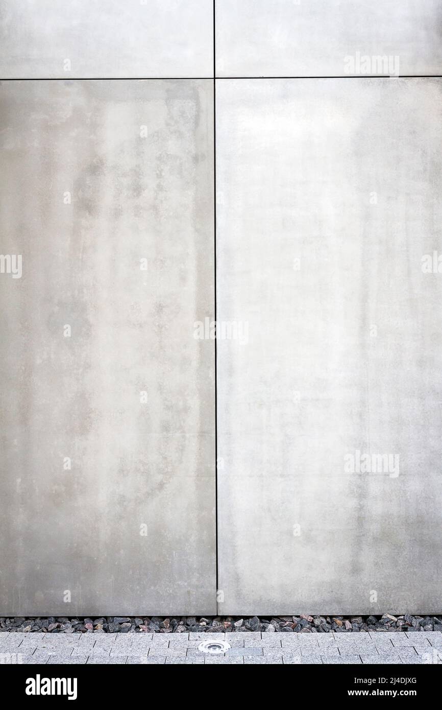 Modern large concrete cement tile wall and a sidewalk Stock Photo - Alamy