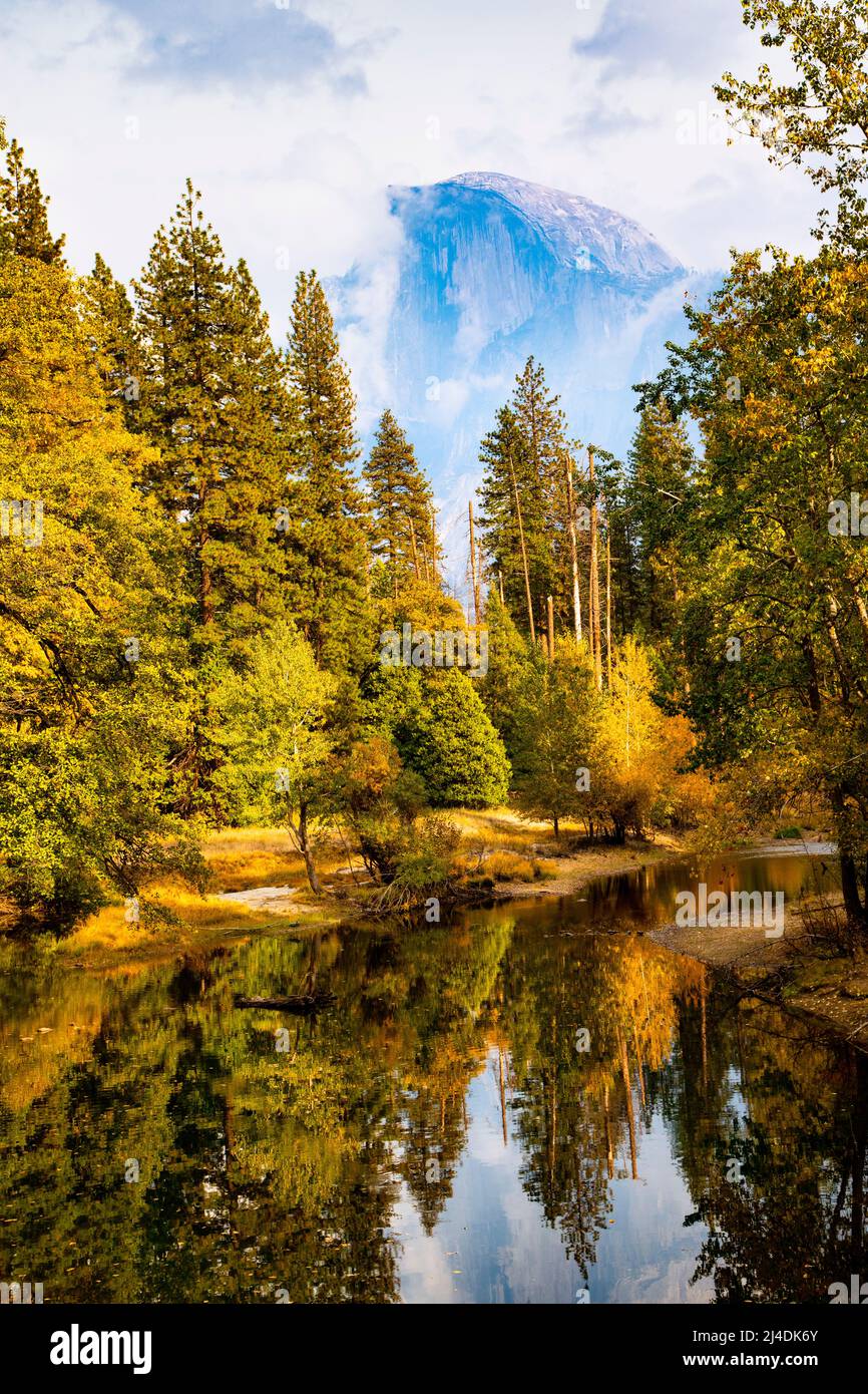The Merced River seemingly flows in front of Half Dome in Yosemite ...
