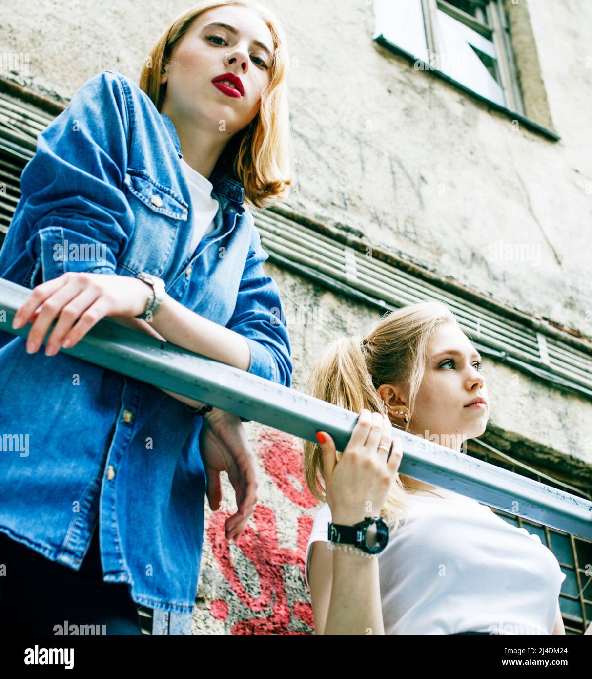couple of teenage girls ouyside on streets chilling, lifestyle people ...