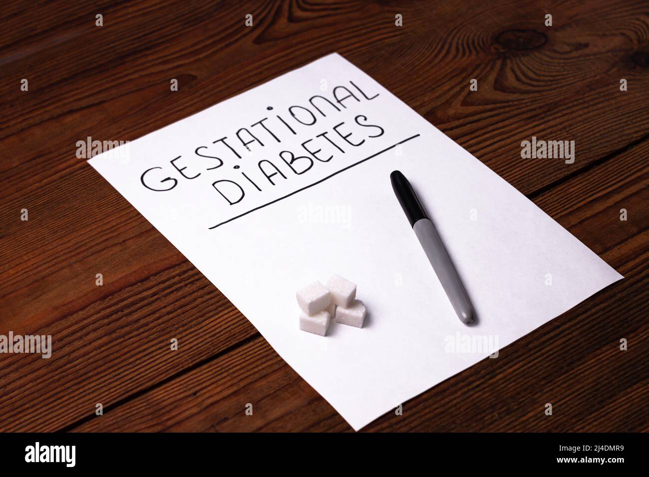 Stop Diabetes sign on a white paper sheet with sugar cubes on wooden ...