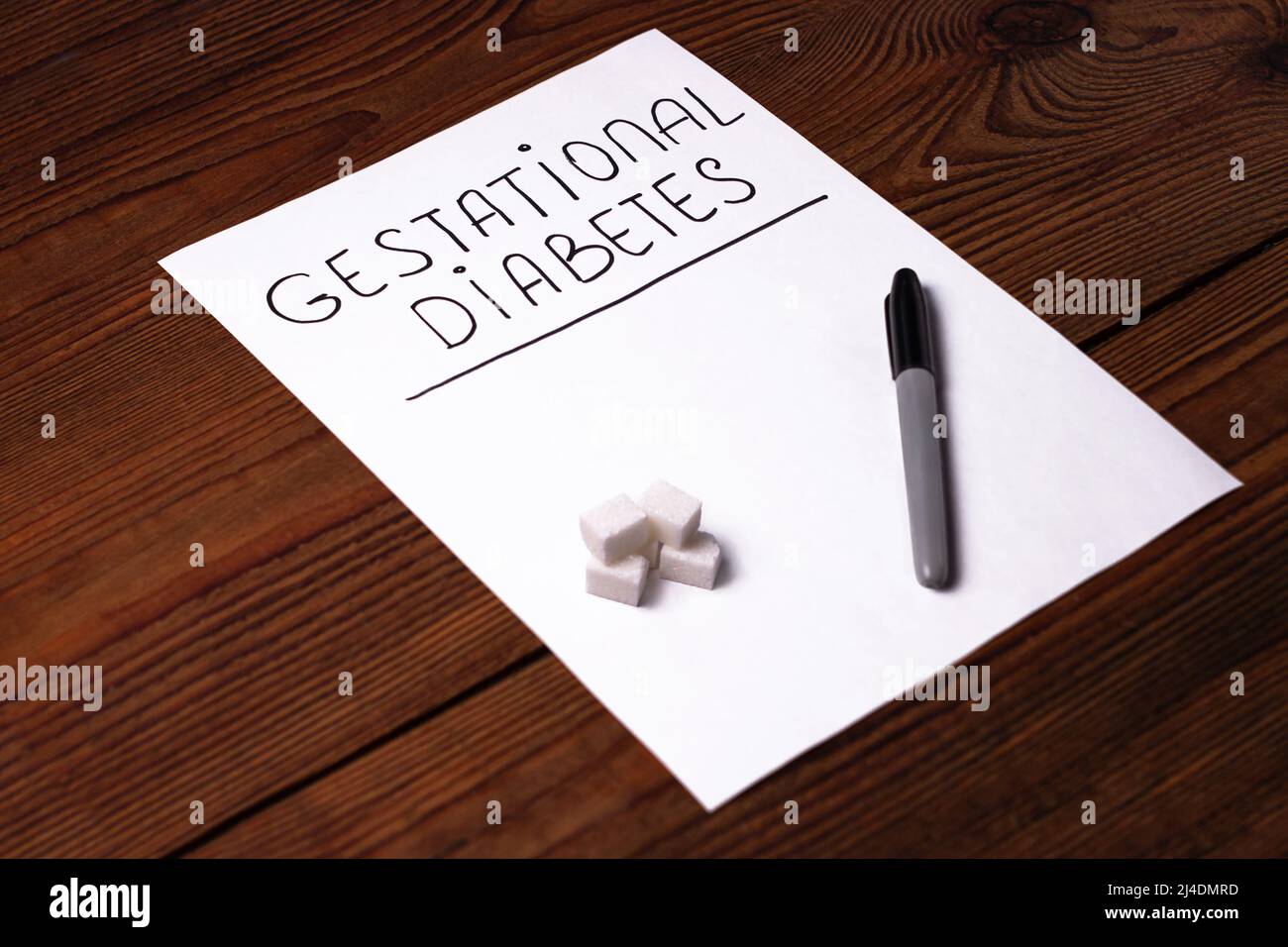 Stop Diabetes sign on a white paper sheet with sugar cubes on wooden ...