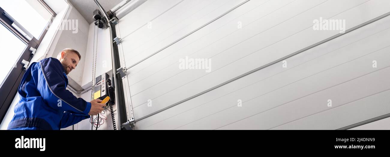 Garage Door Installation And Repair At Home. Contractor Man In House ...