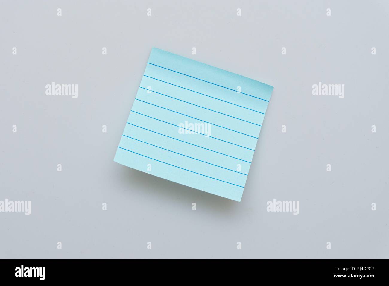 Various colored notepads scattered on a white background Stock Photo ...