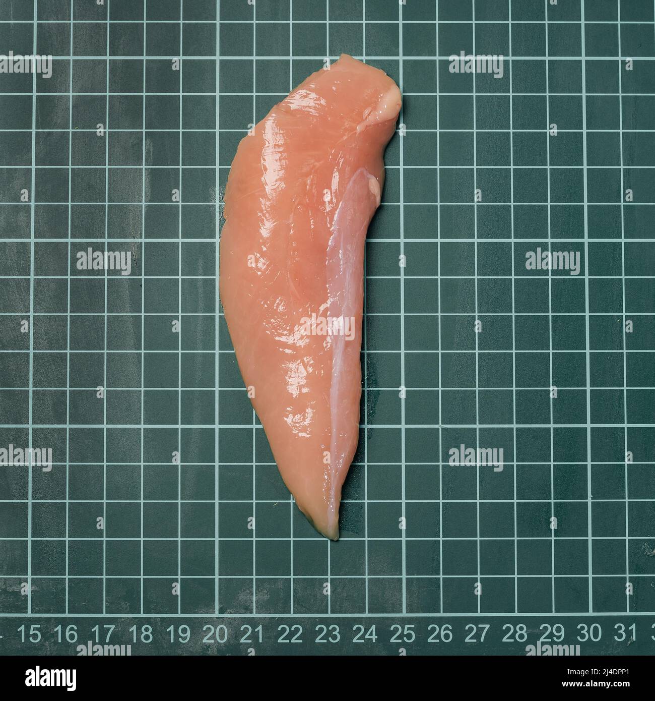 Fresh chicken inner fillet on a linear board. Raw chicken fillet meat ...