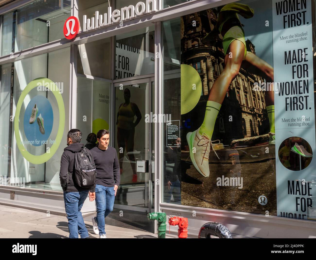 Shoppers in Soho in New York pass the Lululemon store on Saturday ...