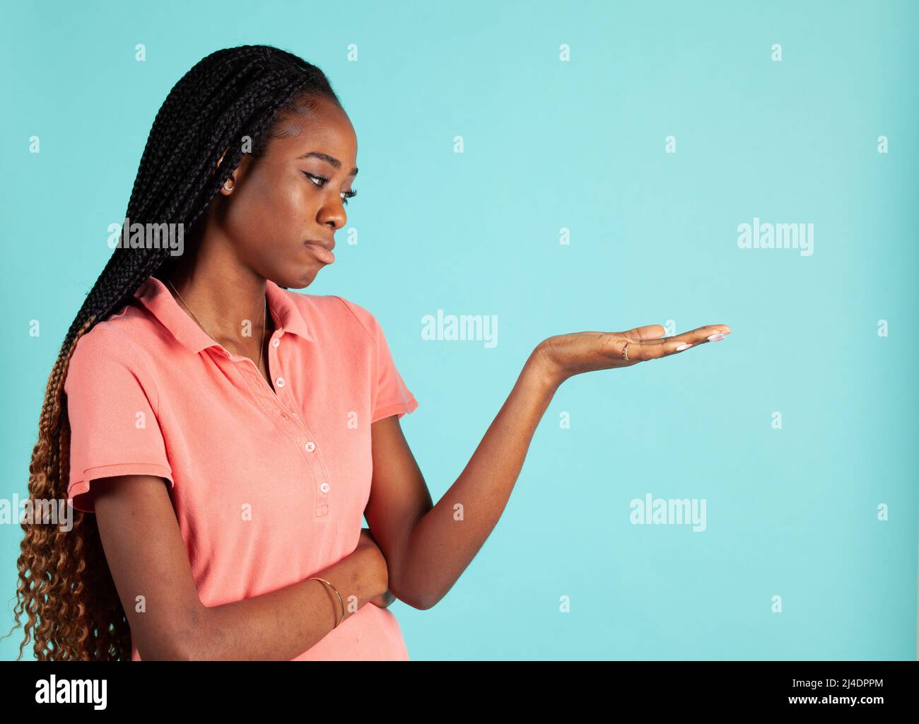 African American woman with upturned palm. Spokesperson pose holding ...