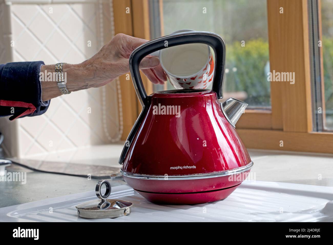 Filling electric kettle with water by the cupful to avoid wasting ...