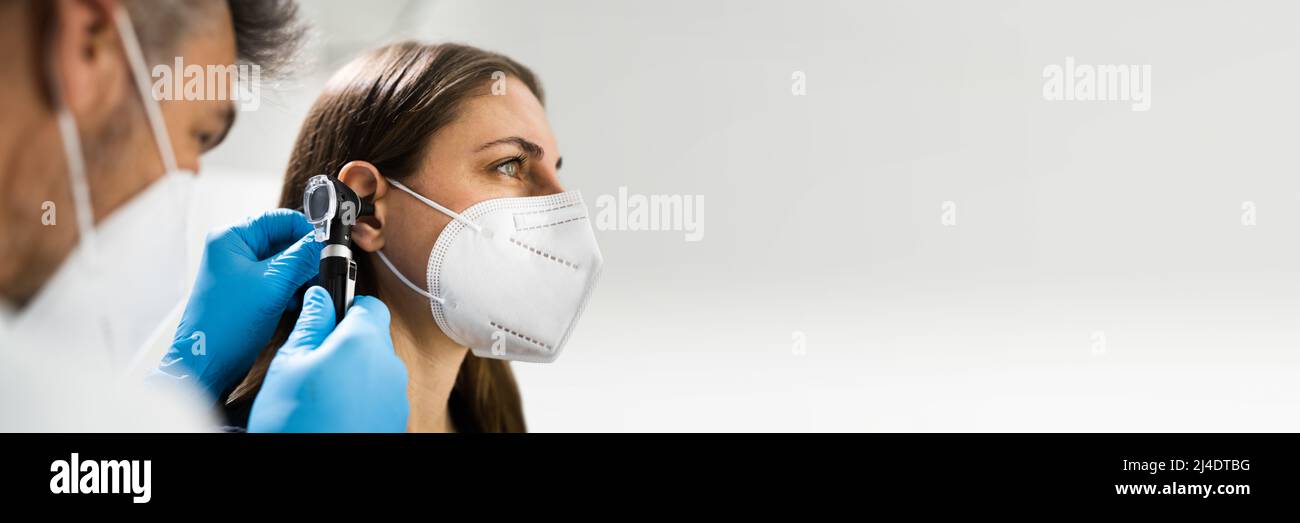 Otolaryngology Doctor Examining Patient Ear In Face Mask Stock Photo ...
