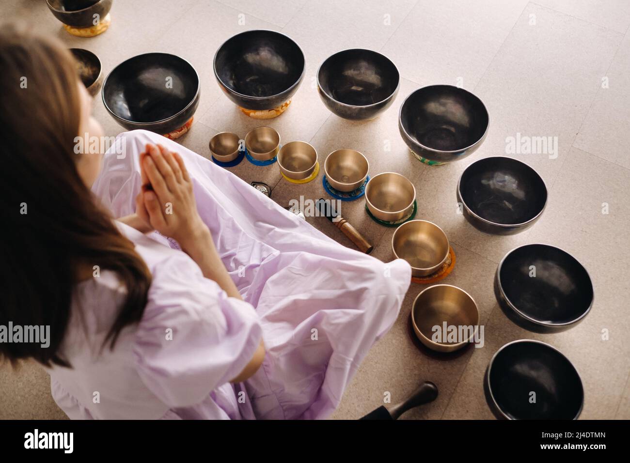 Close-up of a Tibetan singing bowl in your hands - Translation of ...