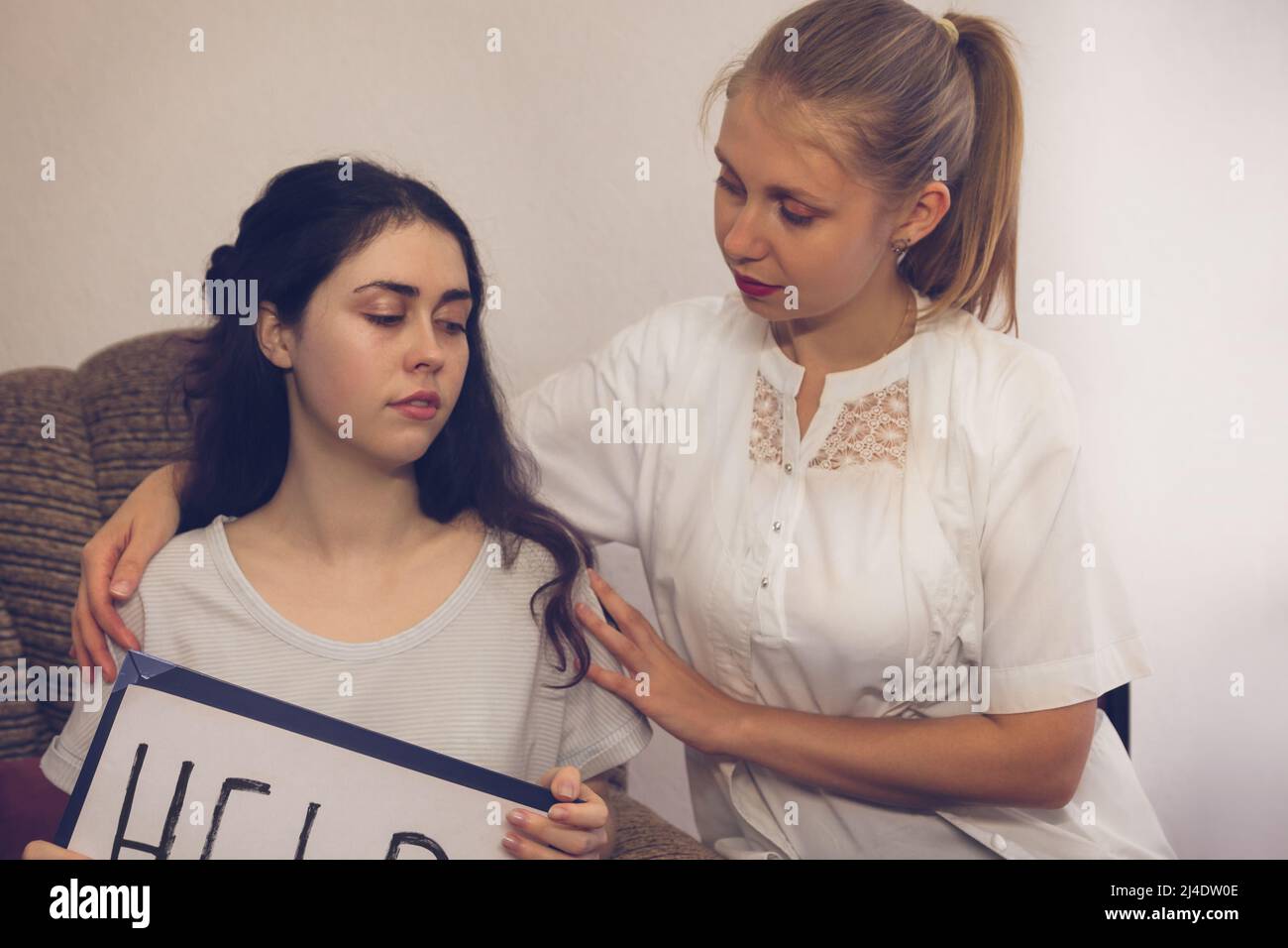 a young girl, the doctor supports the patient in a difficult situation ...
