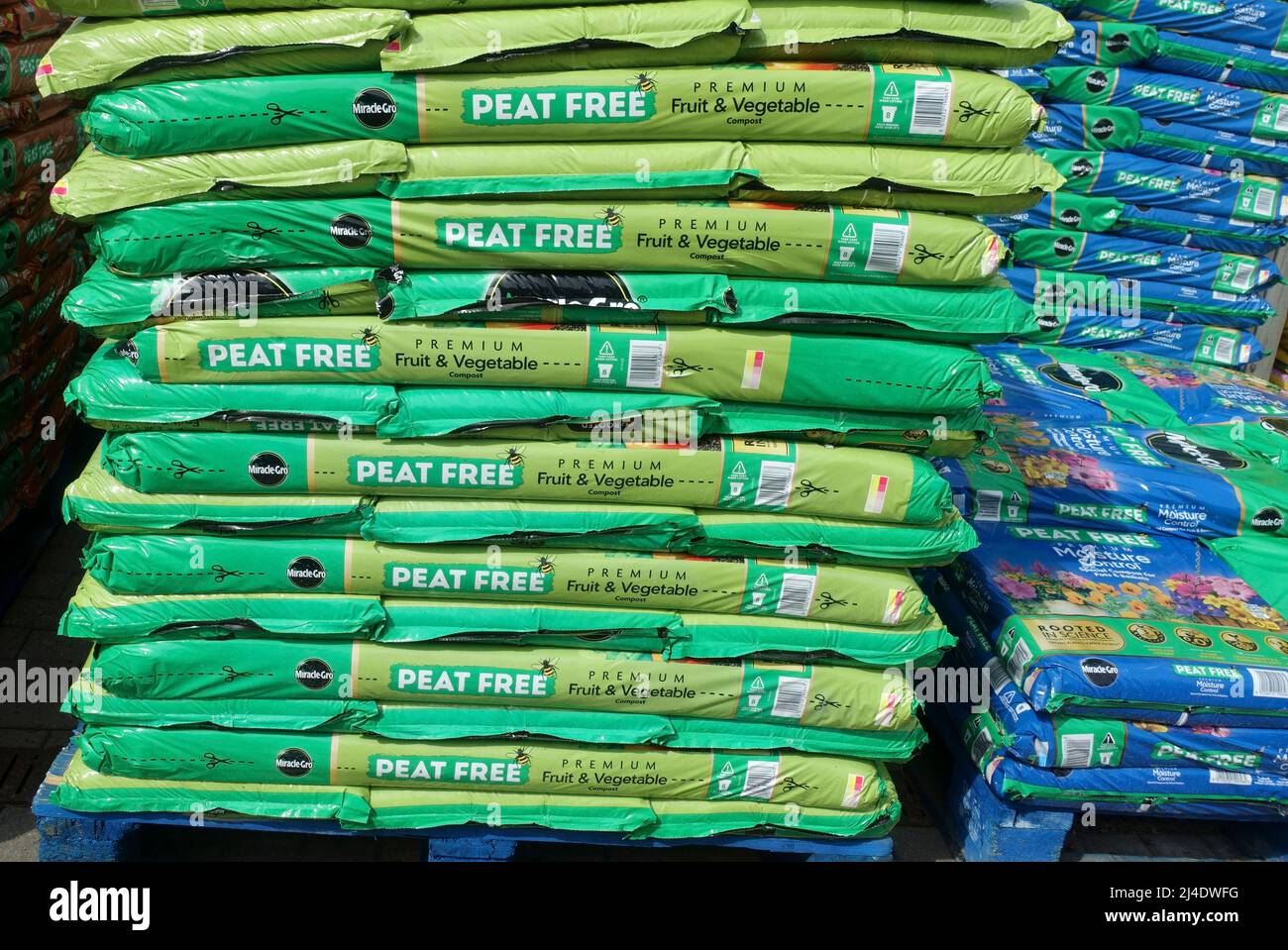 Stack of bags of no peat garden compost in garden centre UK Stock Photo ...