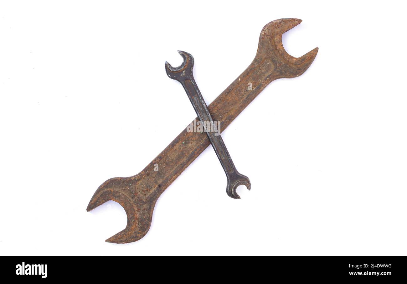 Two old rusty crossed wrenches isolated on white background Stock Photo ...