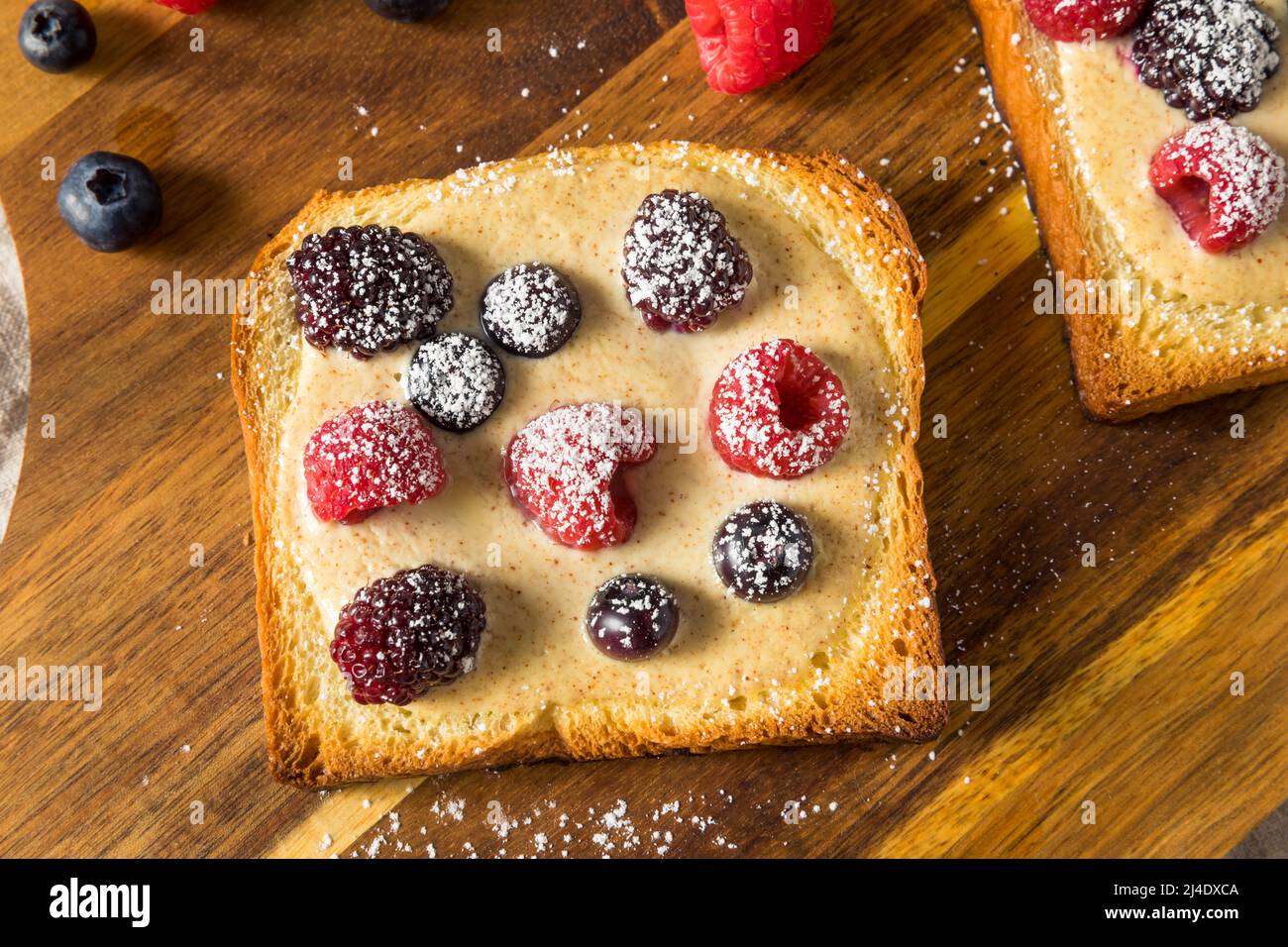 Homemade Trendy Custard Yogurt Toast with Berries Stock Photo - Alamy