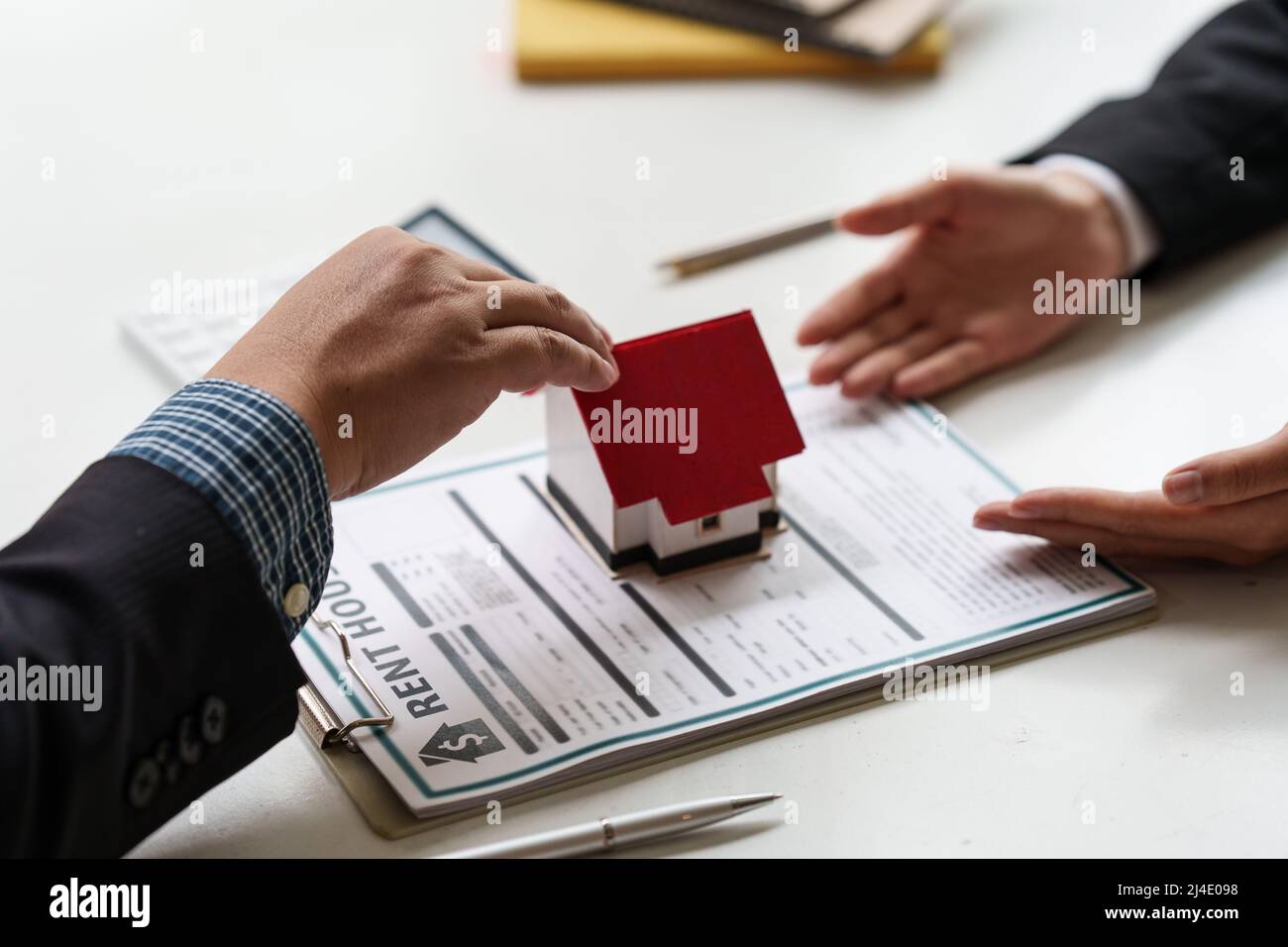 Close up Businessman or agent giving house after signing agreement for ...