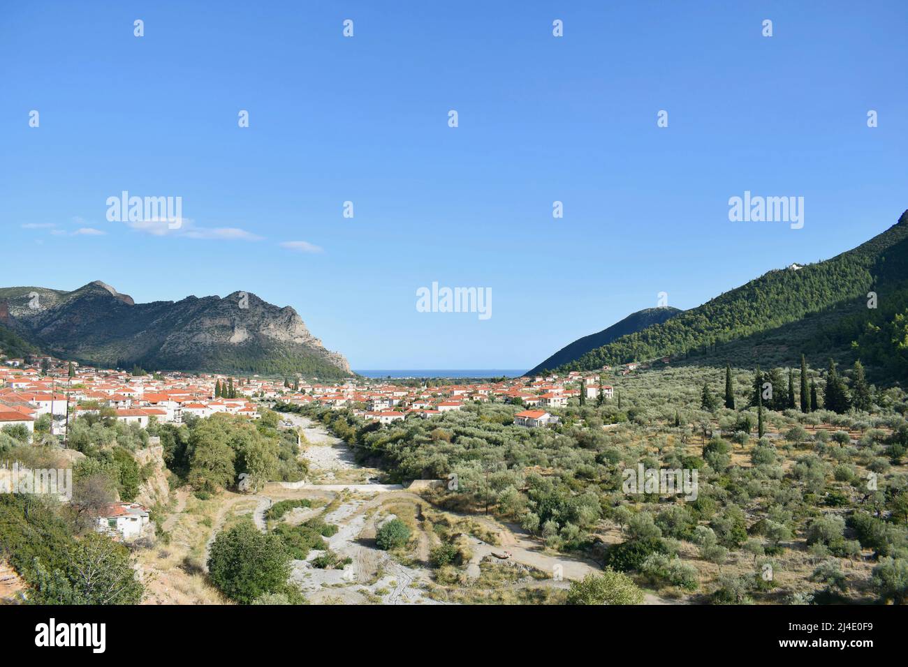 View of Leonidio (traditional greek village) with blue sky and ...