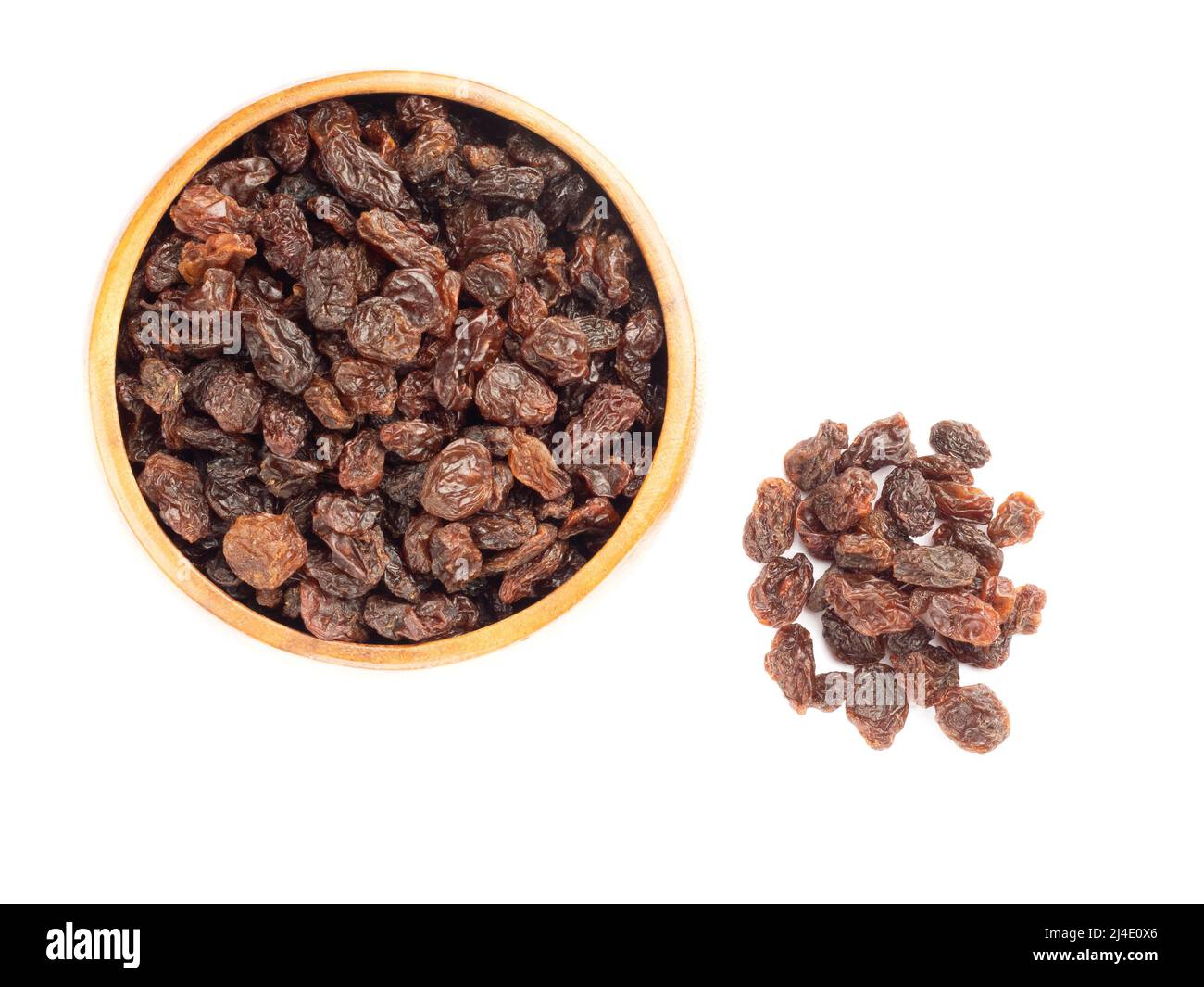 Raisin in brown wooden bowl, bunch, isolated on white background Stock ...