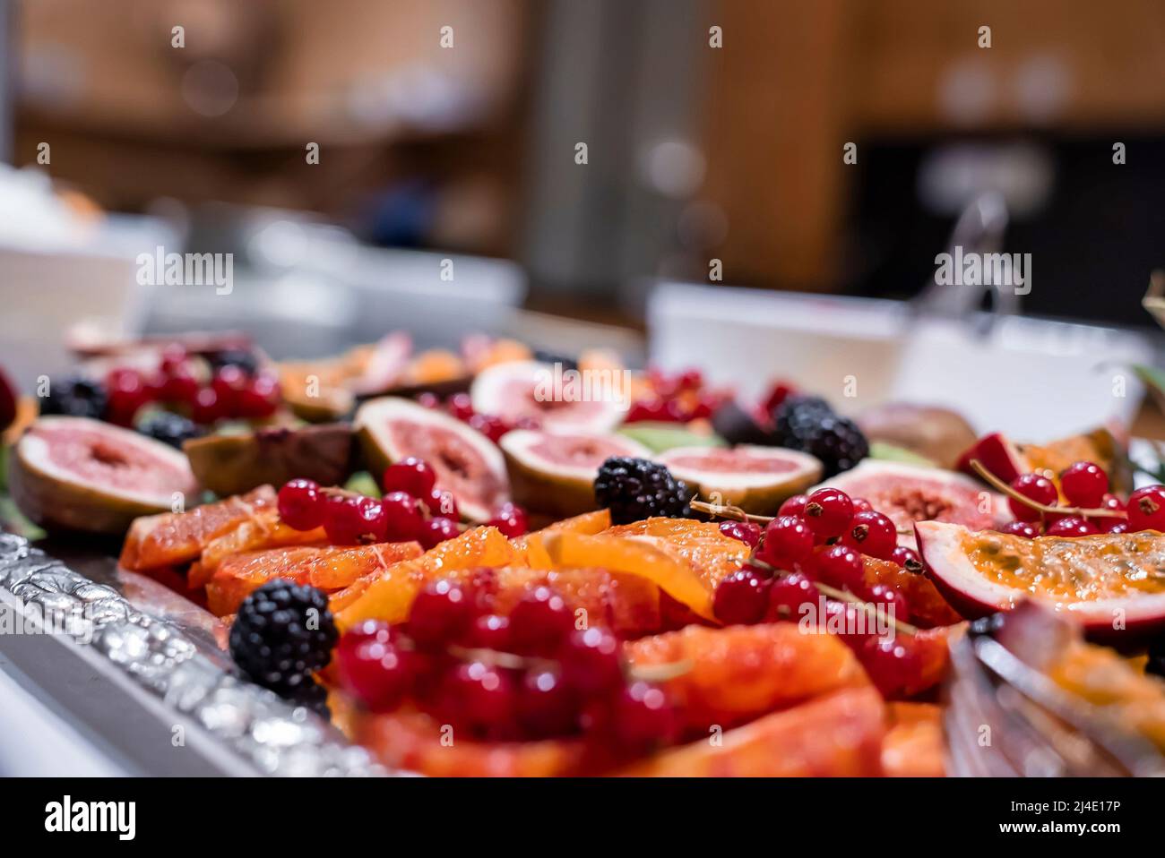 Various healthy fruits served in plate on counter at luxurious hotel ...