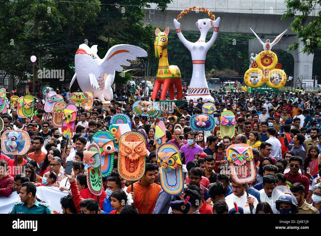 Dhaka, Bangladesh. 14th Apr, 2022. People march along the street with ...