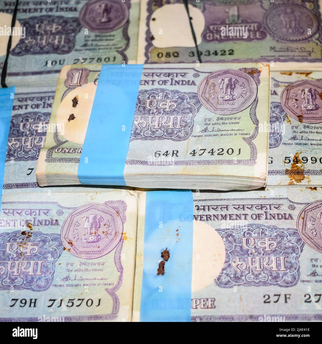 Old One Rupee notes combined on the table, India money on the rotating ...