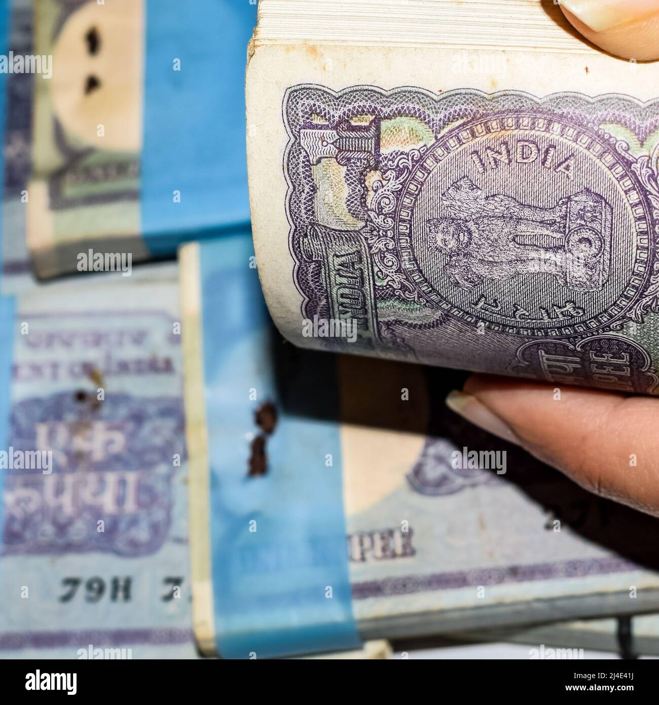 Old One Rupee notes combined on the table, India money on the rotating ...