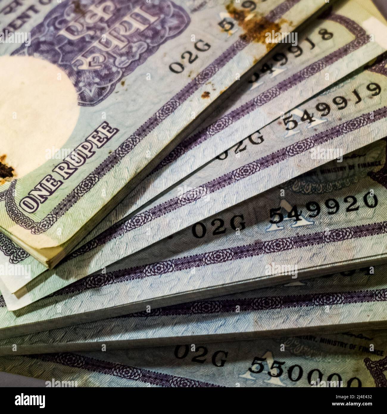 Old One Rupee notes combined on the table, India money on the rotating ...