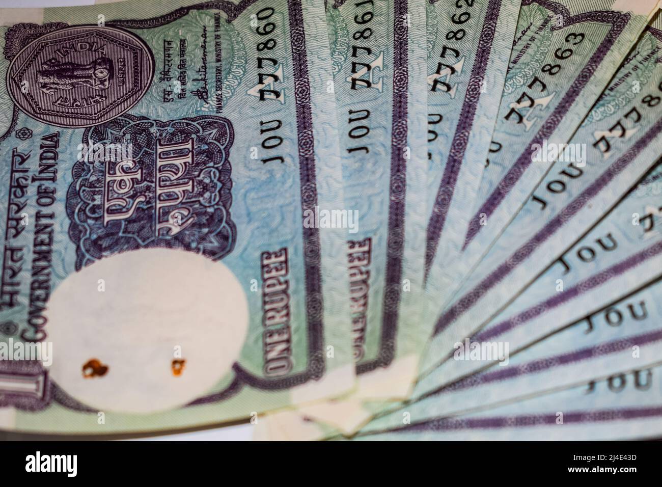 Old One Rupee notes combined on the table, India money on the rotating ...
