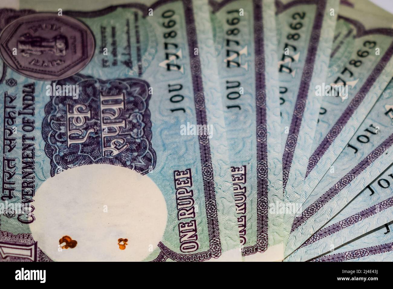 Old One Rupee notes combined on the table, India money on the rotating ...
