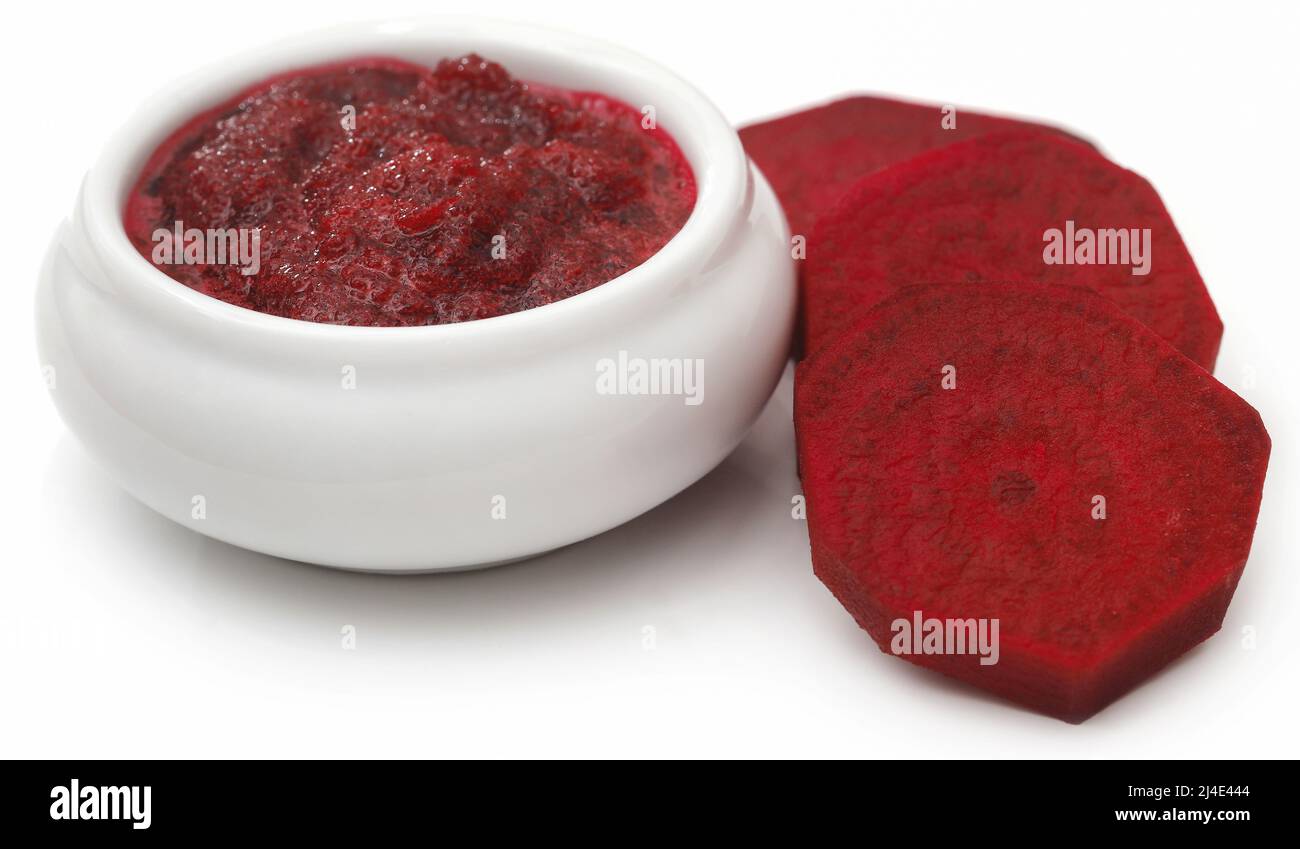 Beetroot with paste in a bowl over white background Stock Photo - Alamy