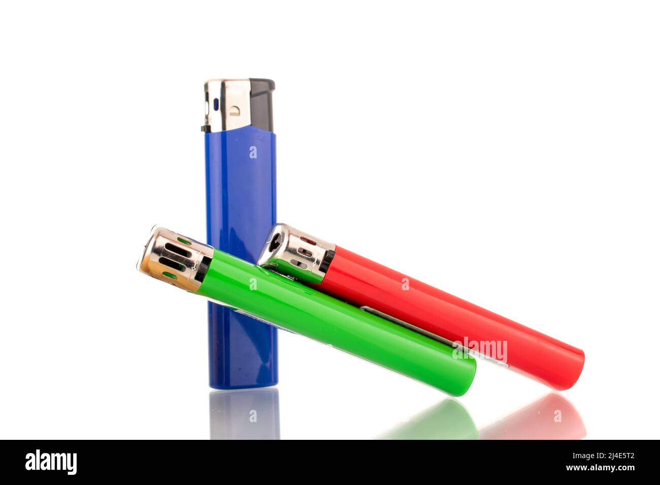 Three colored lighters, macro, isolated on a white background Stock ...