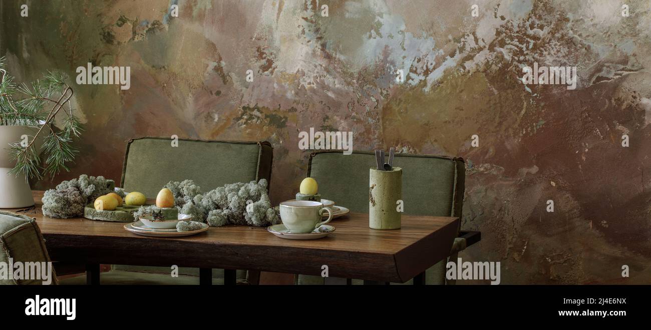 Table setting for Easter dinner decorated with forest moss, eggs ...