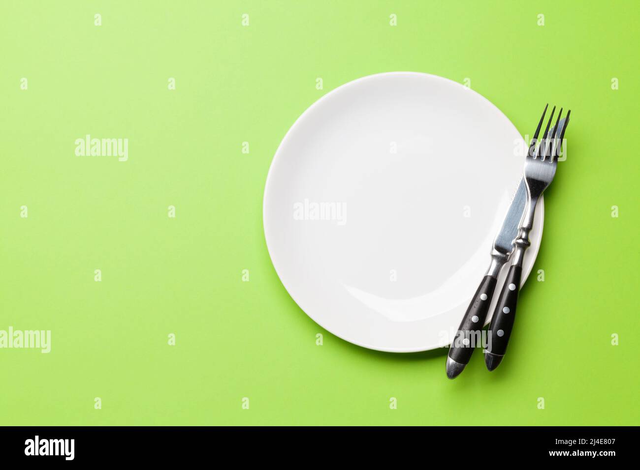 Empty plate and silverware. Top view flat lay with copy space. Template ...