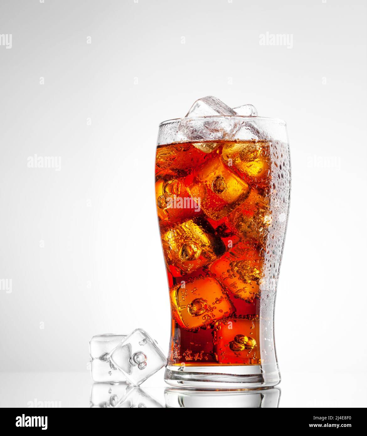 Cola with ice. Fresh cold sweet drink with ice cubes Stock Photo - Alamy